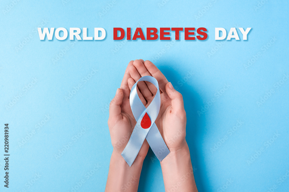 inscription world diabetes day and blue ribbon awareness with red blood ...