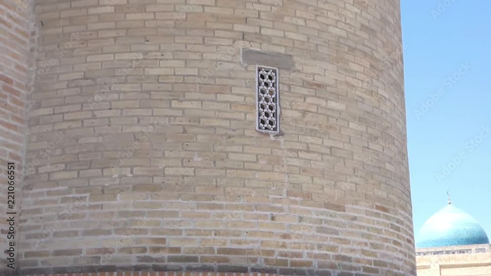 High oval tower of bricks, ancient Asian buildings. the details of the ...