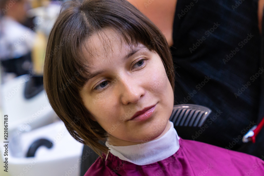Beautiful young woman in hairstyle salon getting bob haircut Stock ...
