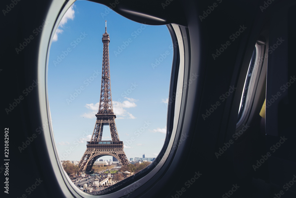 Eiffel as seen through window of an aircraft. Stock Photo | Adobe Stock