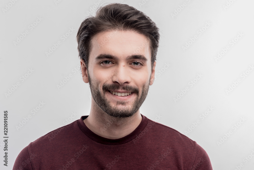Smiling man. Handsome bearded green-eyed young man smiling broadly ...