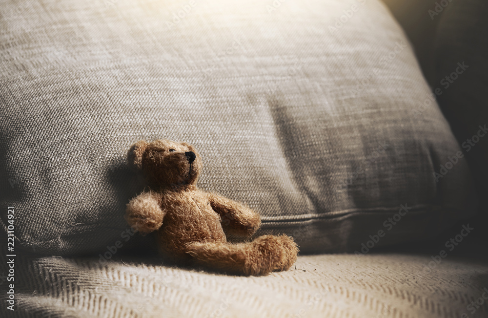 Teddy bear sitting down on sofa in retro filter, Lonely teddy bear ...