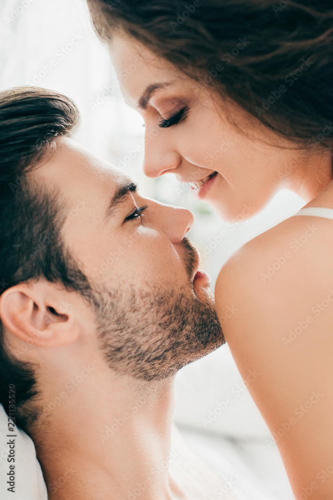 close-up view of sensual happy young couple able to kiss in foreplay Stock Photo | Adobe Stock