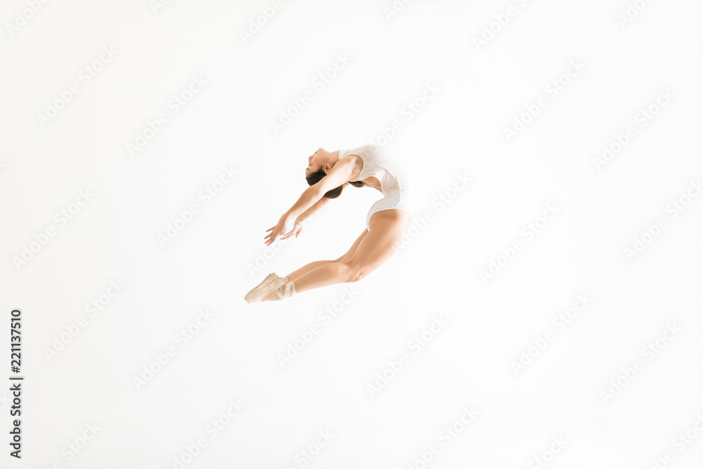 Ballet Dancer Performing High Jump And Backbend On White Background ...