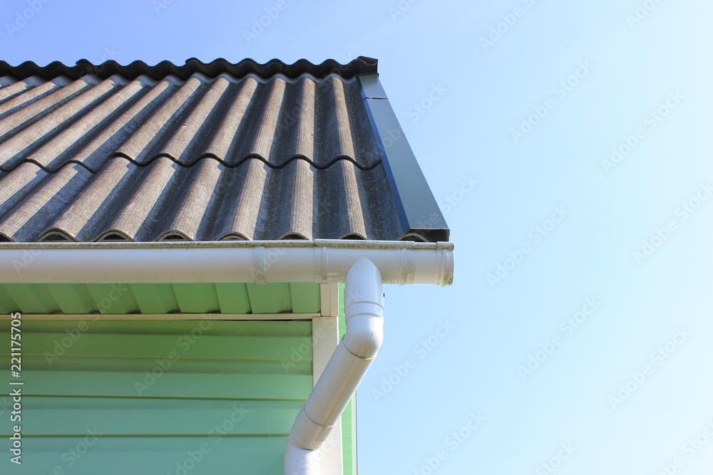 House Corner with Gutter, Roof Top Tiles, Drainage System and Azure ...