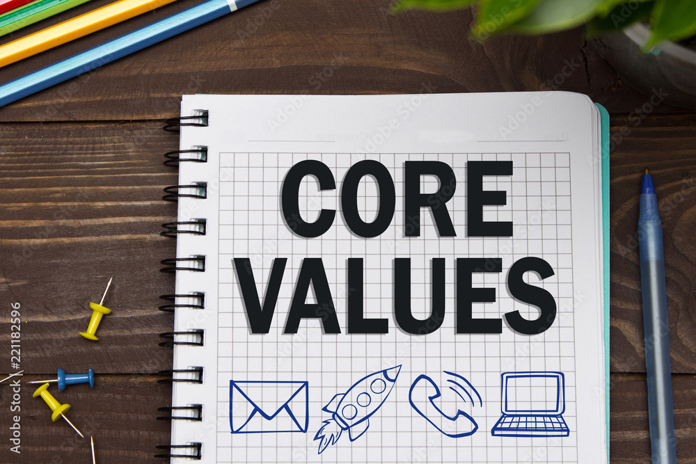 Notebook with a Business notes CORE VALUES on the office table with ...