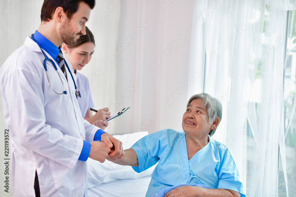 Concept of healing care. The doctor is healing old woman. The doctor is ...