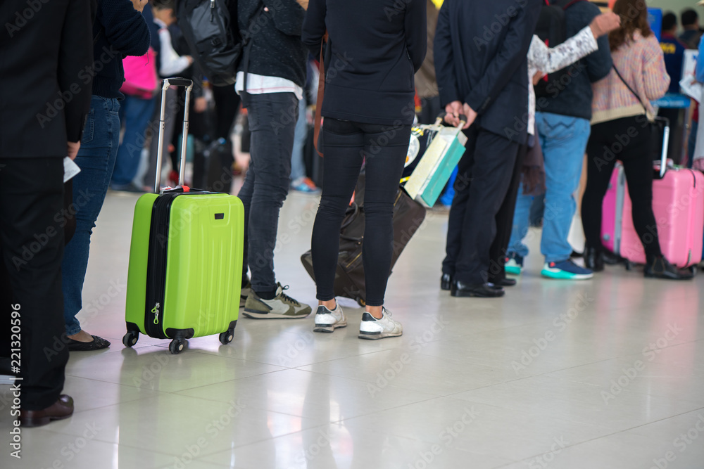 Queue of Asian people waiting at boarding gate at airport. Closeup ...