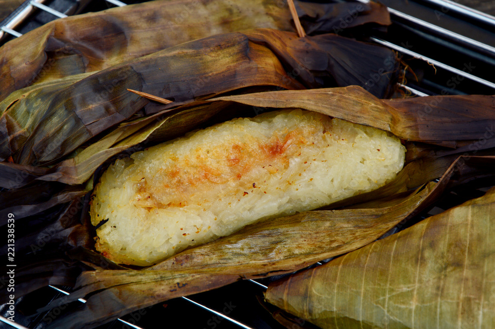 Grilled stuffed Glutinous rice wrapped in banana leaves or sticky rice ...