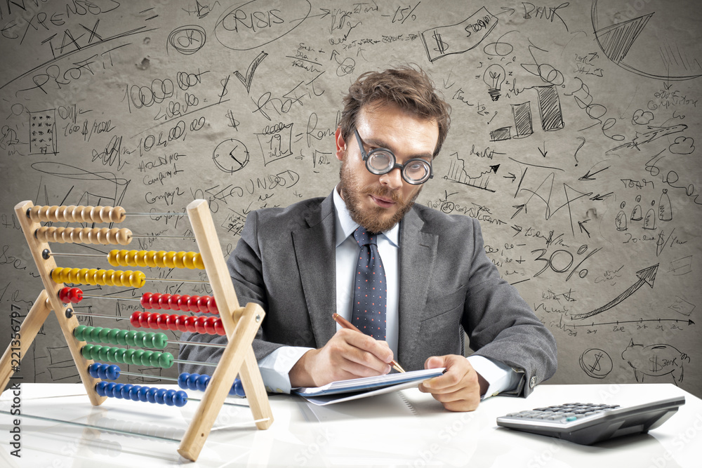 Nerd accountant does calculation of company revenue Stock Photo | Adobe ...