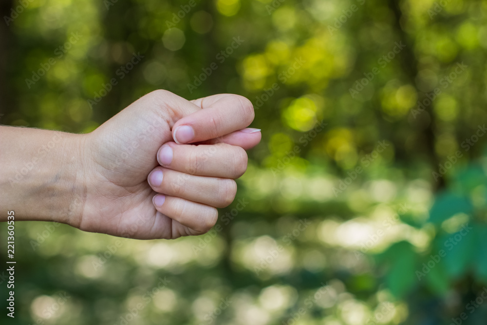 human sign and symbols concept of fig hand and fingers shape by girl on ...