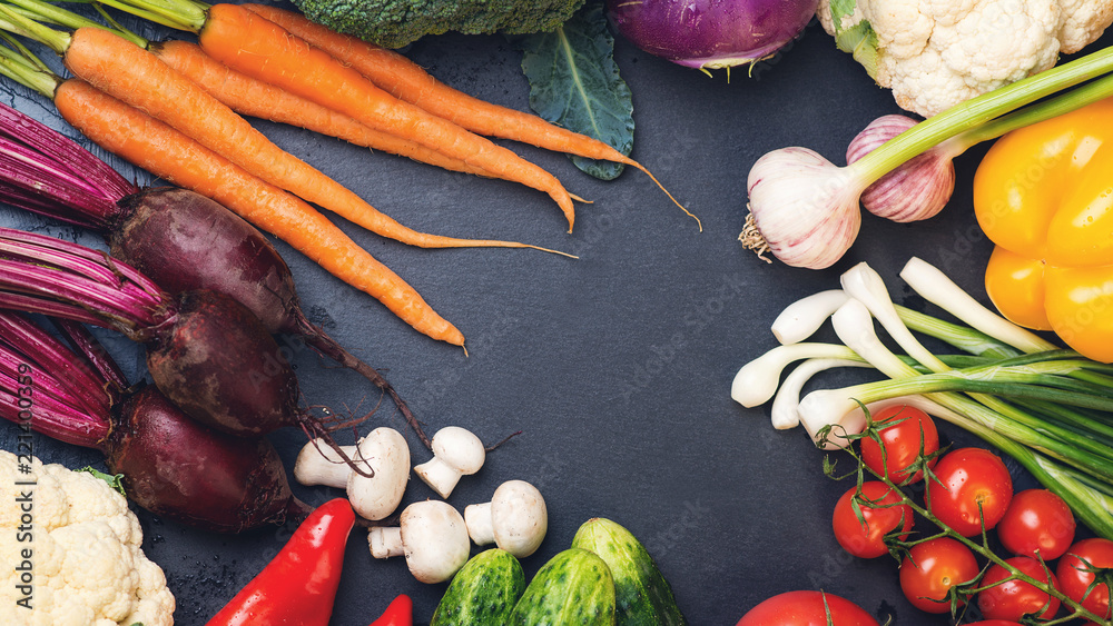 Vegetables background. Fresh vegetables on black background. Copy space ...