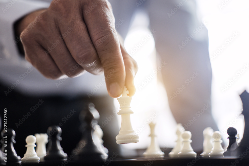 Businessman's hand playing chess game to development analysis new ...
