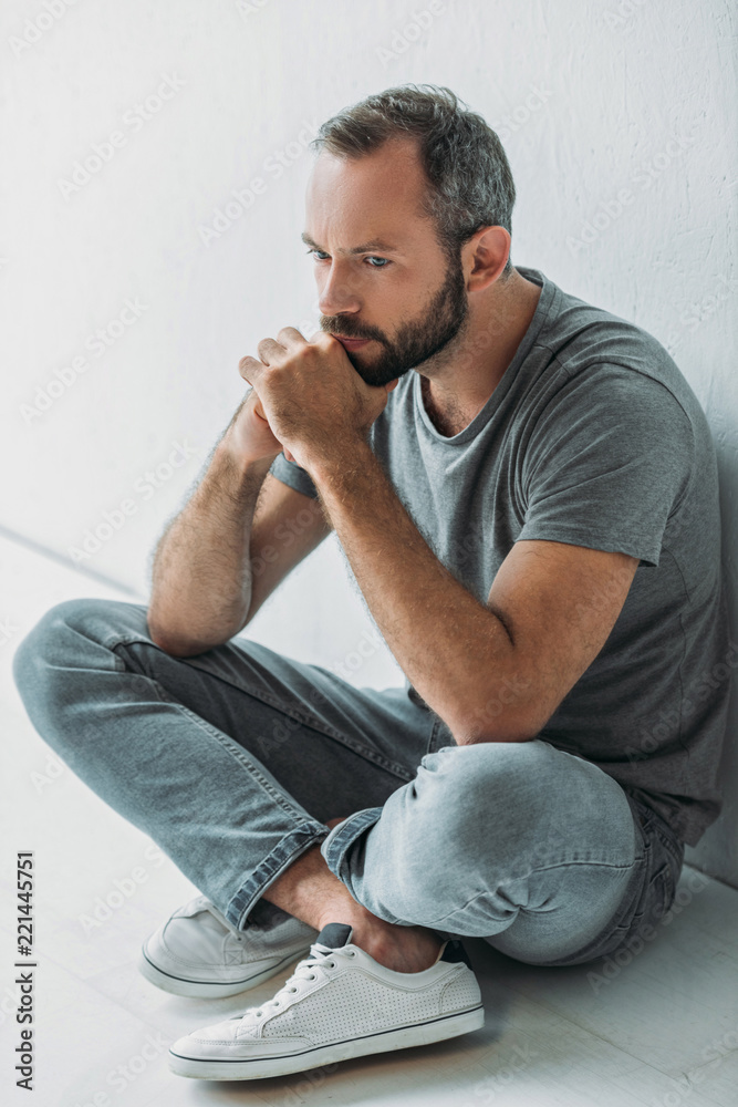 Person Sitting On Ground Facing Away