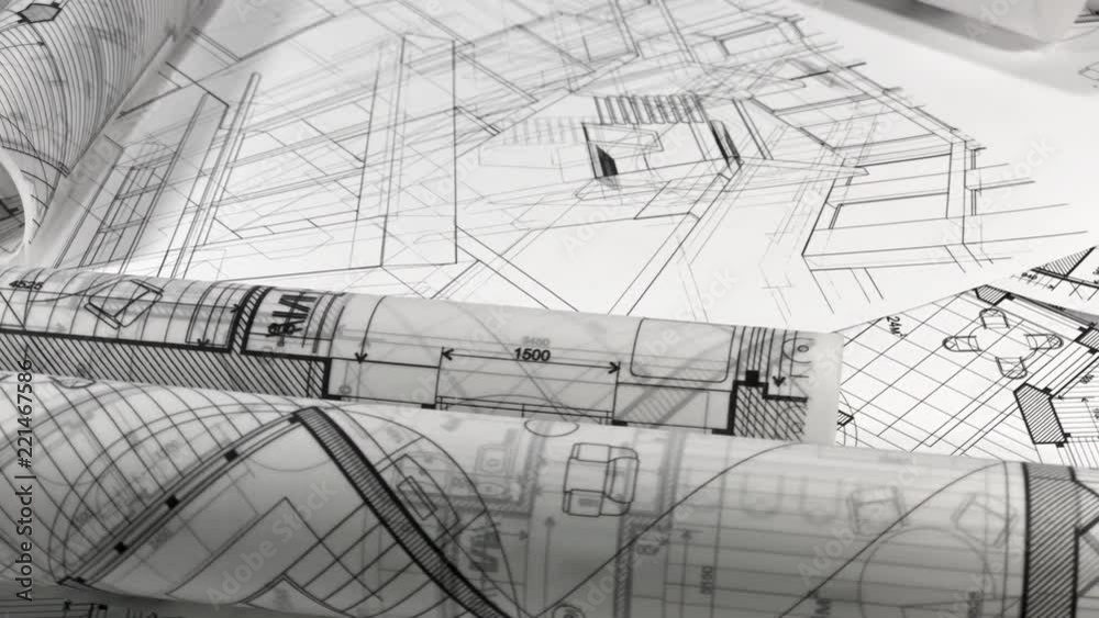 Blueprints - rolls of architectural drawings smoothly rotate on the ...