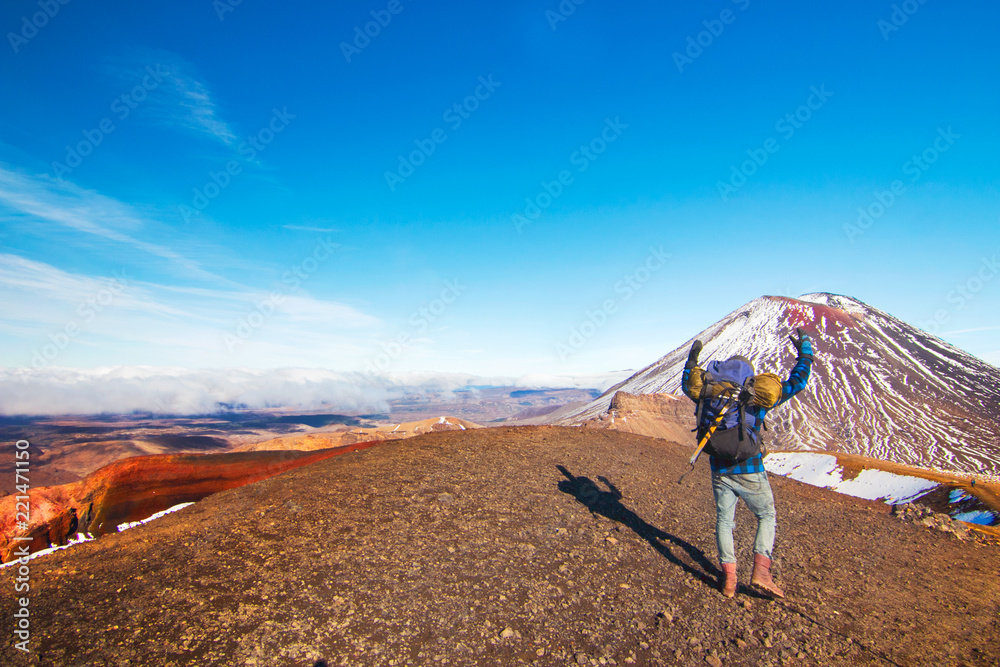 The back view of man- happy traveler and tramper in wild mountains of ...