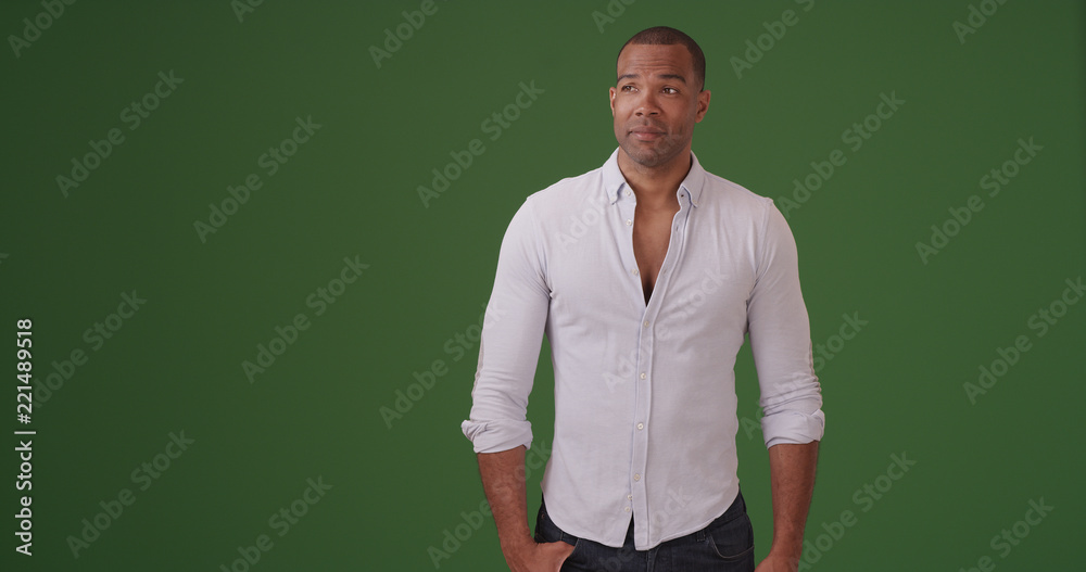 Handsome young black man standing on green screen Stock Photo | Adobe Stock
