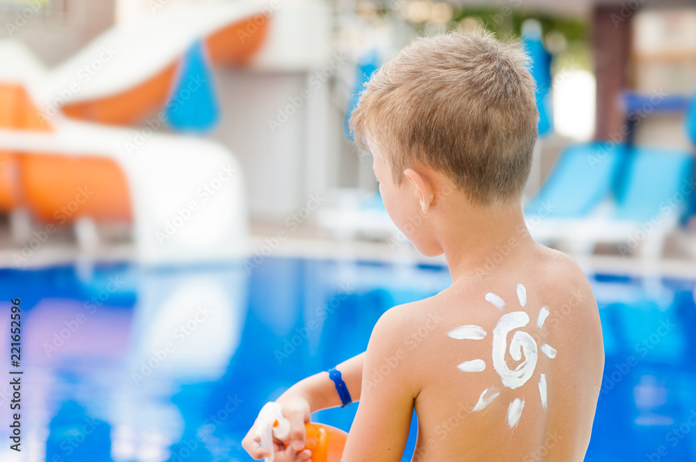 Young boy with sun painted by sun cream on his shoulder. Summer ...