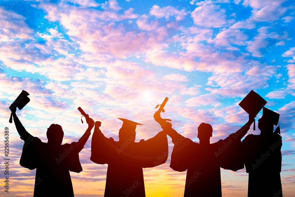 Silhouette of Student Graduation. They are seeing sunset. They are ...