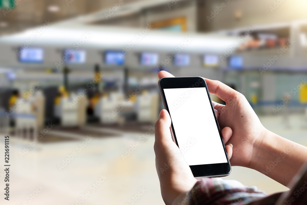 Travller using Smartphone in airport terminal. For Graphics Display ...