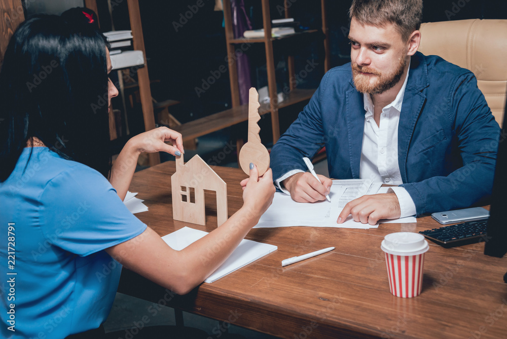 Man sign a home insurance policy on home loans. Estate agent with ...