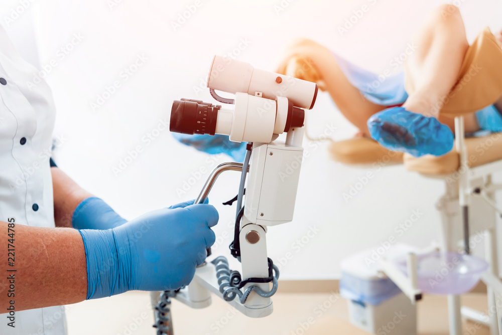 Gynecologist examining a patient with a microscope. Stock Photo | Adobe ...