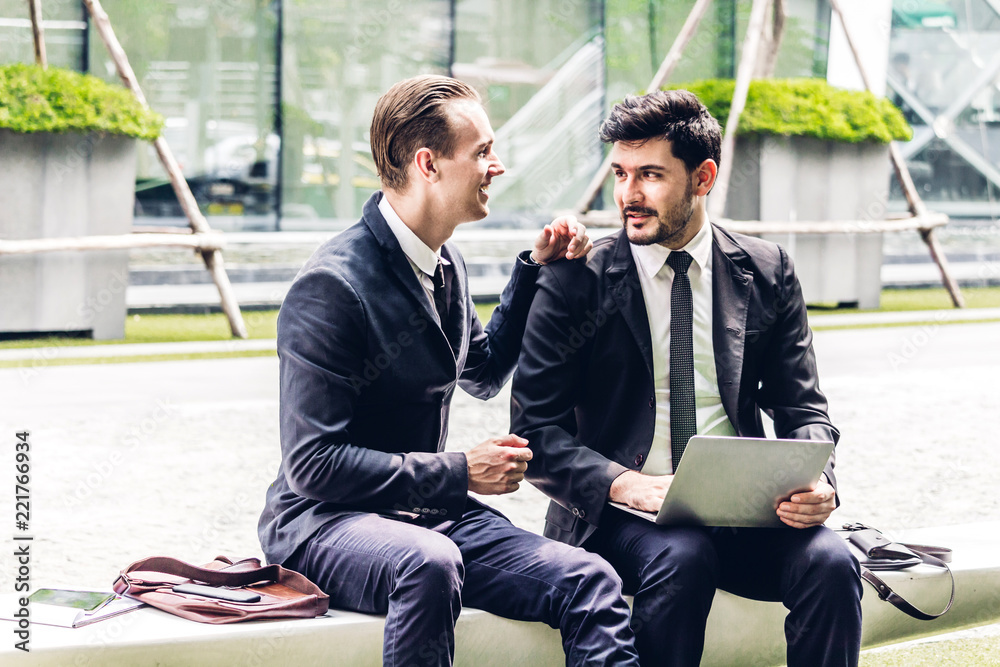 Image two business partners in black elegant suit talking and working ...