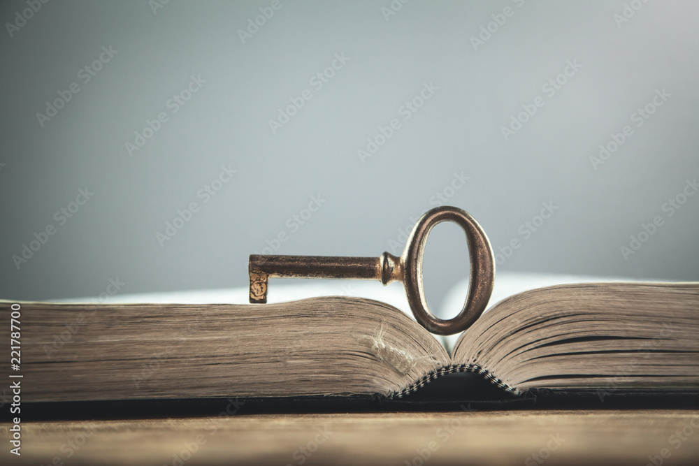Old key on bible. Concept of wisdom and knowledge Stock Photo | Adobe Stock