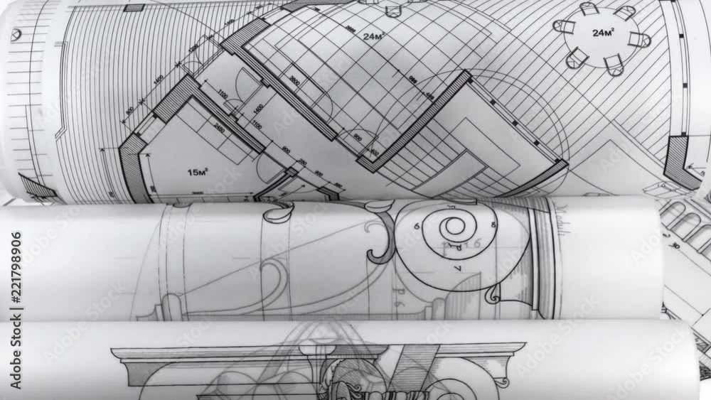 Blueprints - rolls of architectural drawings smoothly rotate on the ...
