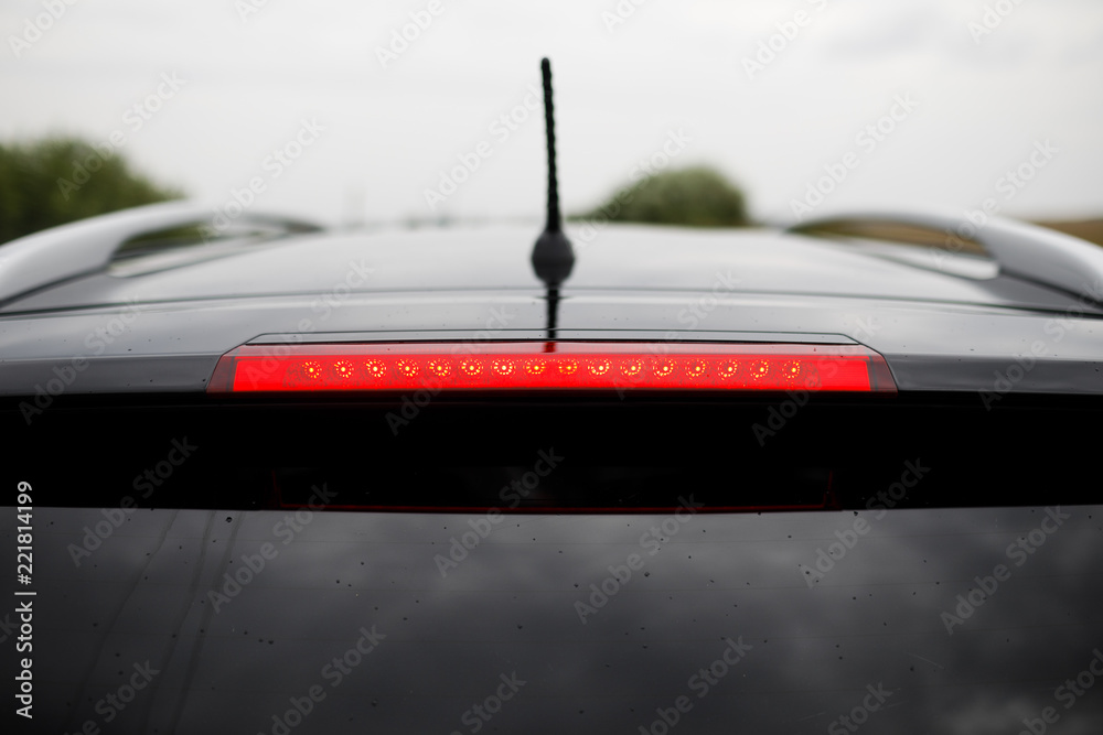 Black premium city crossover, luxury SUV rear light closeup. Stock ...