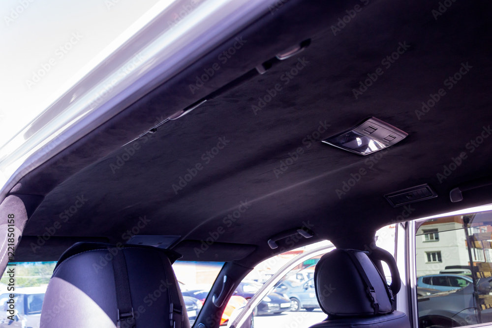The ceiling of the SUV car pulled by black Alcantara material in the ...