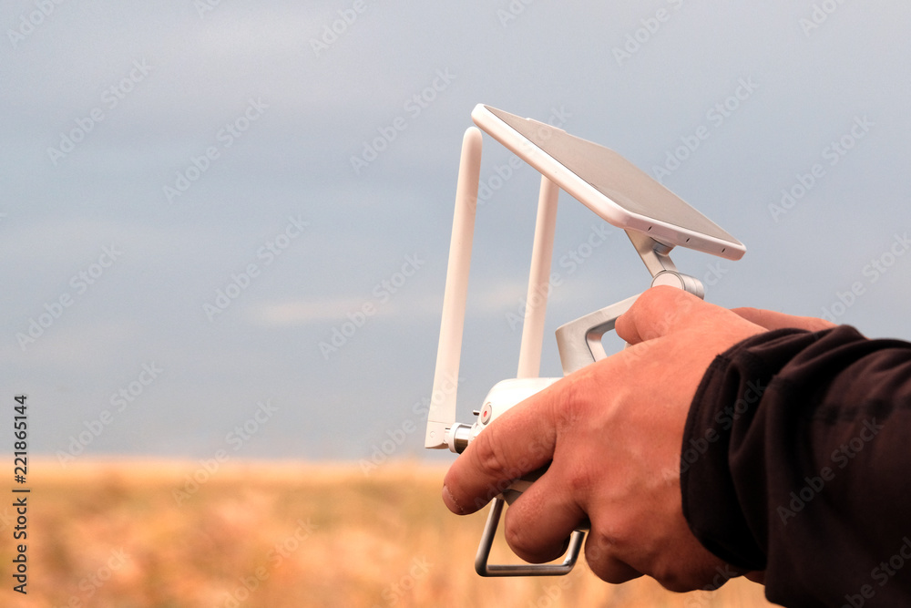 White control panel from an unmanned aerial vehicle in the hands of a ...