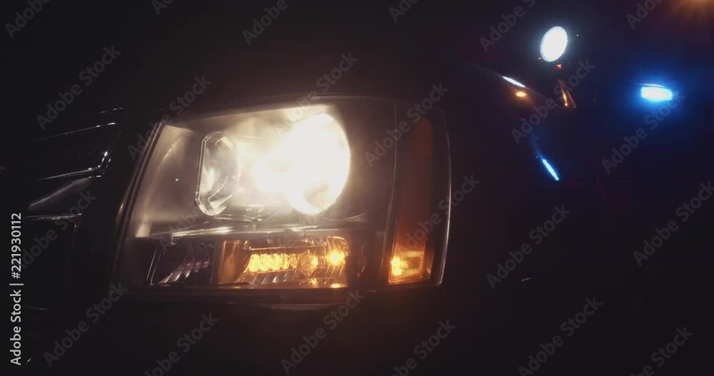 front headlights of police car with lights on Stock Video | Adobe Stock