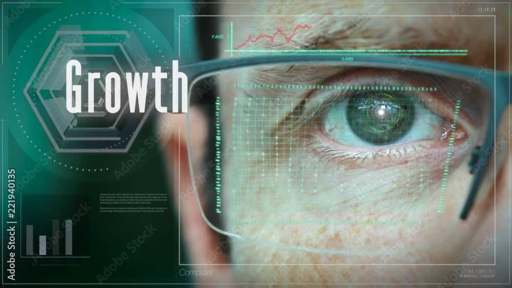 A close up of a businessman eye controlling a futuristic computer ...