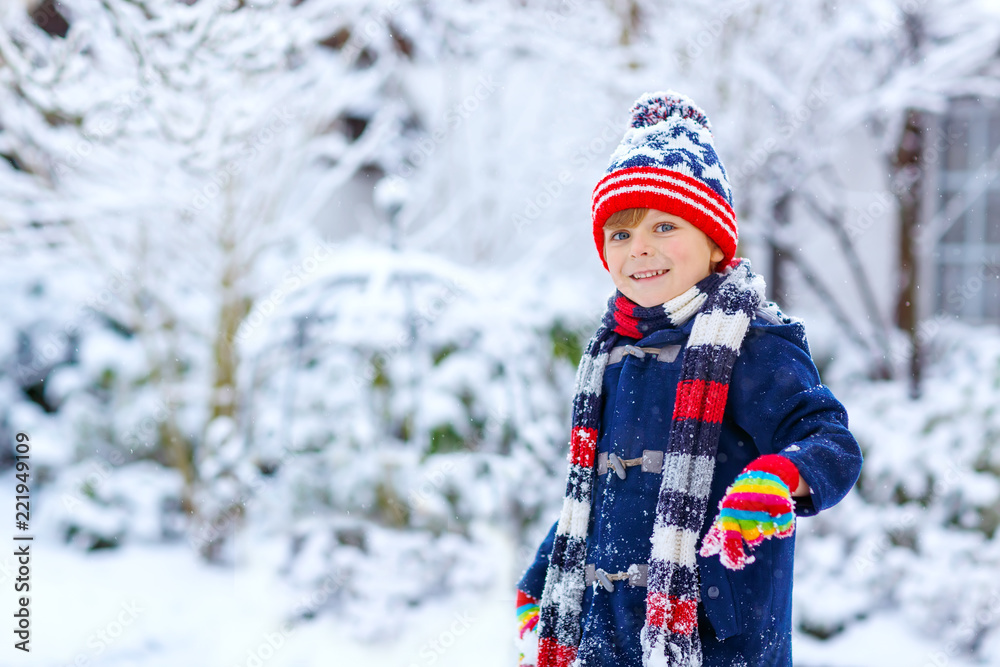 Cute little funny child in colorful winter fashion clothes having fun ...