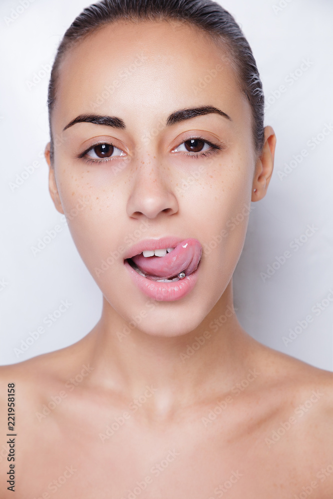 Beautiful Woman Sticking Out Her Tongue And Showing Her Young Piercing