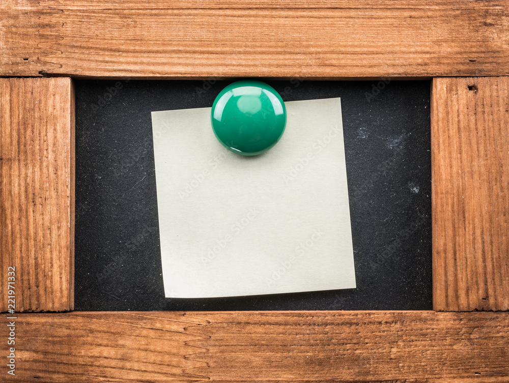 Blackboard and post-it notes stuck with colorful magnets. Stock-Foto ...