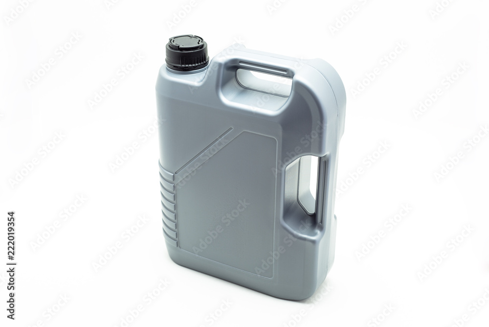Grey, plastic motor oil container with a capacity of five liters ...
