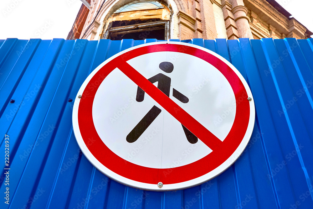 white with red lines and a man sign prohibiting the movement of people ...