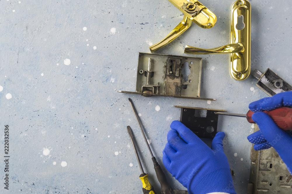 Repair of the door lock. Stock Photo | Adobe Stock