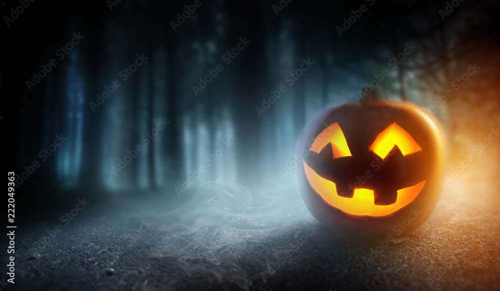 A mysterious and spooky misty halloween evening background with a ...