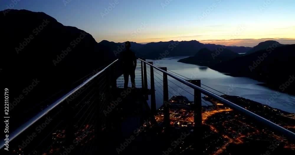 Beautiful sunset footage of a male silhouette on top of the mountain ...
