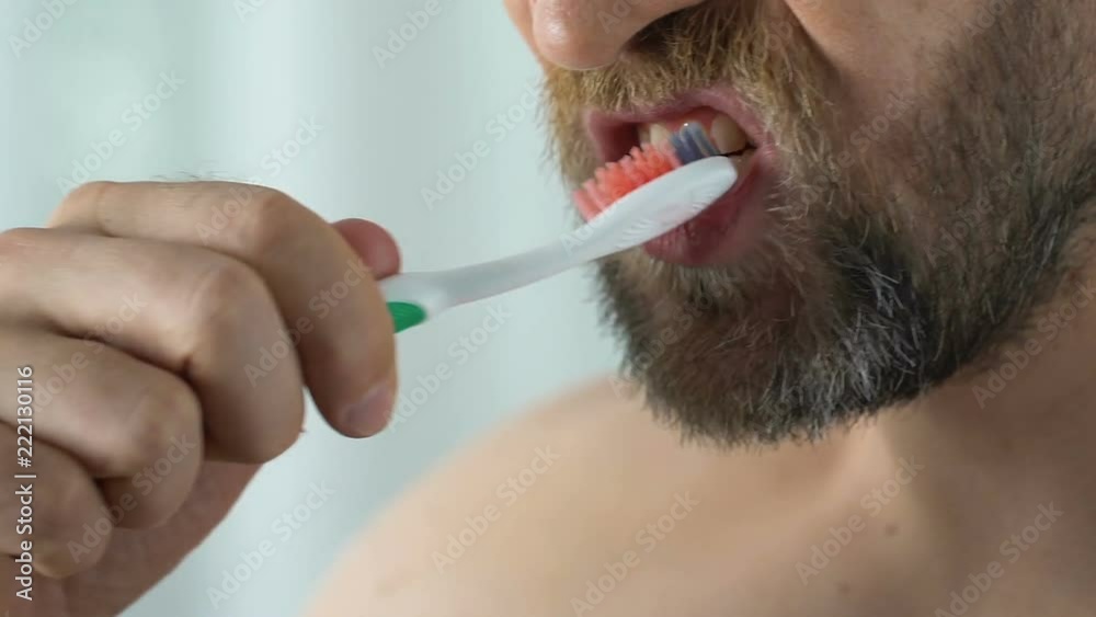 Dentist patient has bleeding gum while brushing teeth, hypersensitivity ...