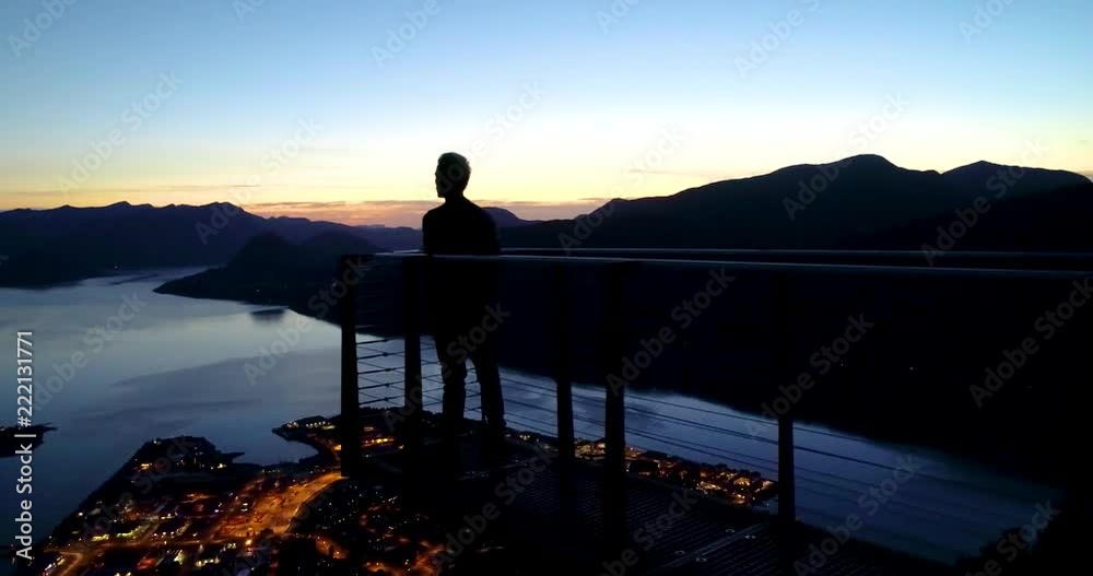 Beautiful sunset footage of a male silhouette on top of the mountain ...