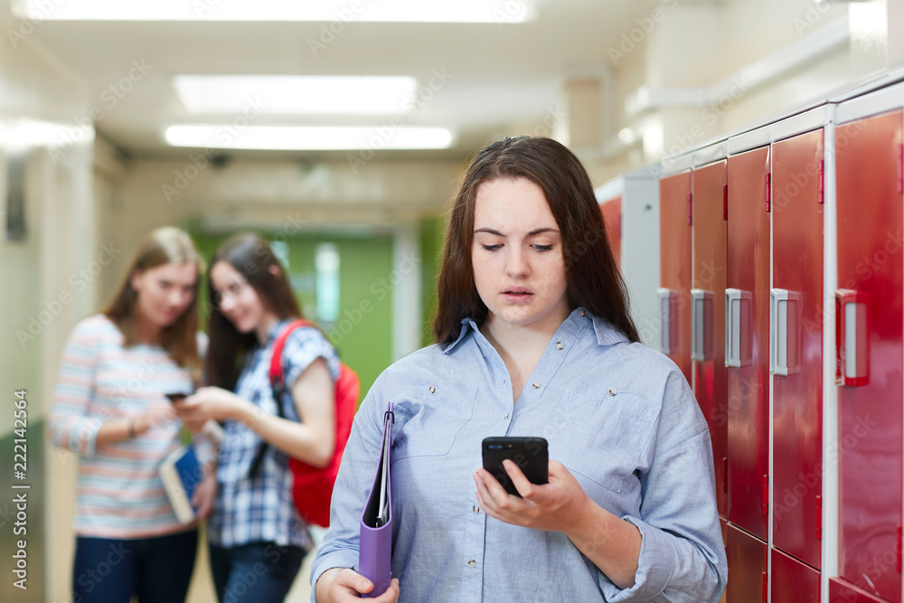 Female High School Student Bullied By Text Message In Corridor Stock ...