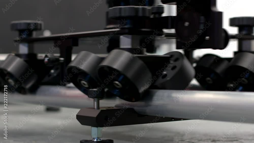 Rubber wheels rolling across scaff pole speed rail as part of a camera ...