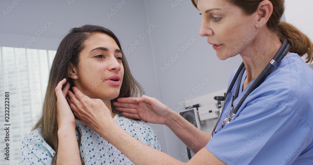 Young attractive latina patient showing irritation around neck lymph ...