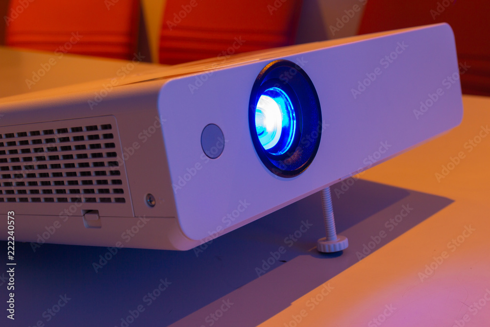 projector for presentation in a meeting room (Light in a light yellow ...