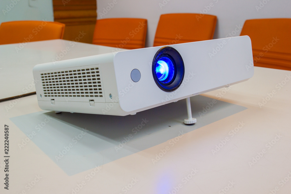 projector for presentation in a meeting room (Light in a light yellow ...