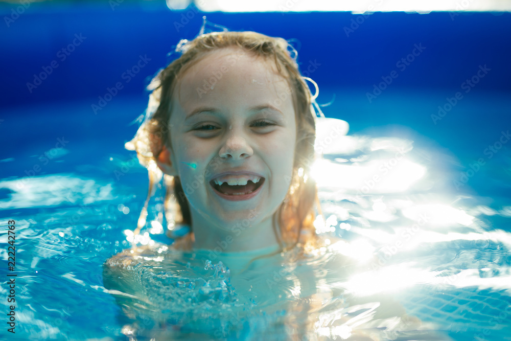 Smiling adorable seven years old girl playing and having fun in ...